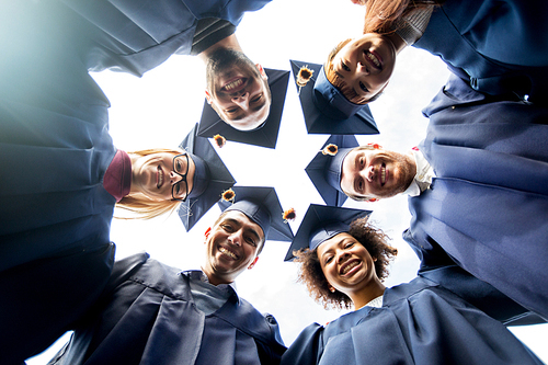 education, graduation and people concept - group of happy international ...