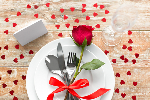 valentines day, table setting and romantic dinner concept - close up of ...