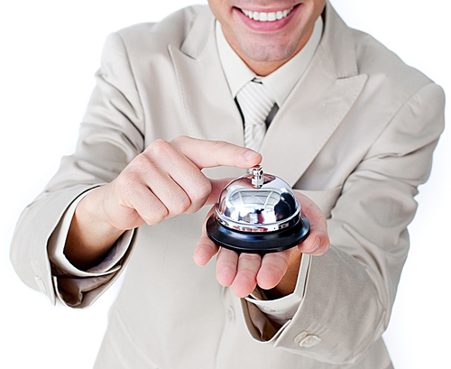 유토이미지 | Smiling businessman using a bell