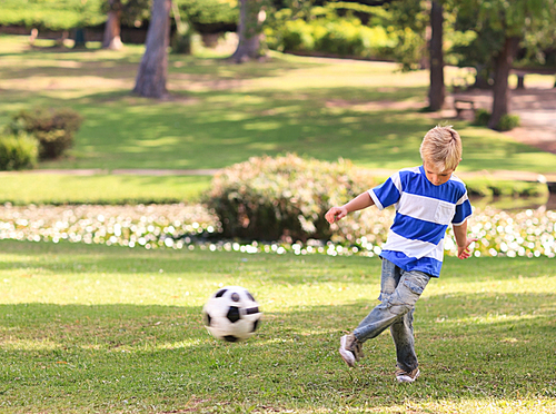 유토이미지 | Boy playing football in the park
