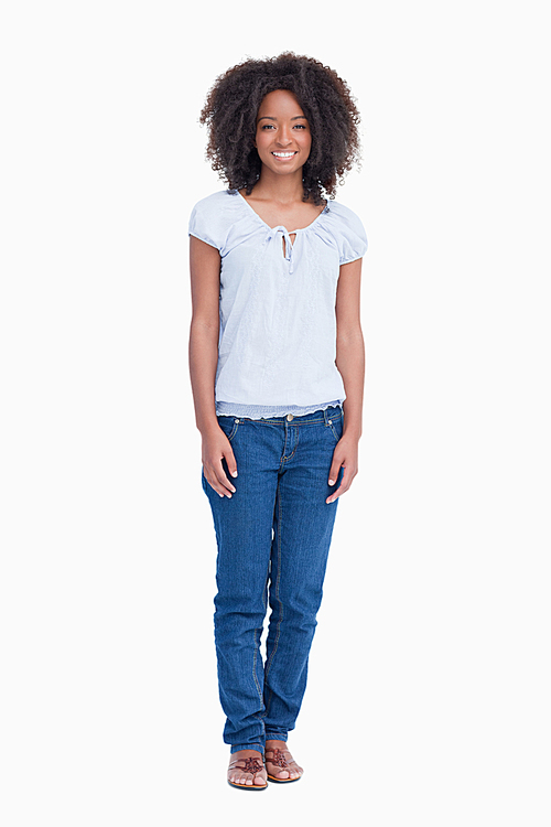 Relaxed young woman standing upright with arms by side | 유토이미지 | 상세페이지 ...