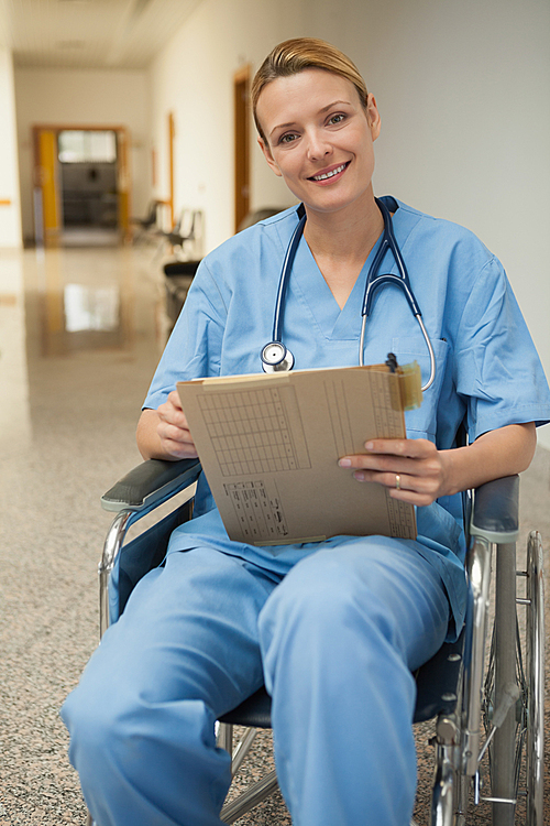 smiling nurse checking her notes in a . | 유토이미지 | 상세페이지 | 베이직샵 | 사진 ...
