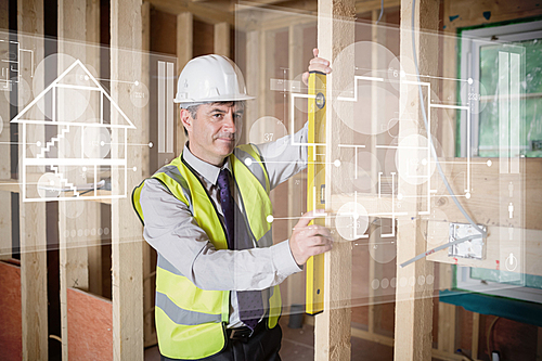 Architect using spirit level while looking at white hologram interfaces ...