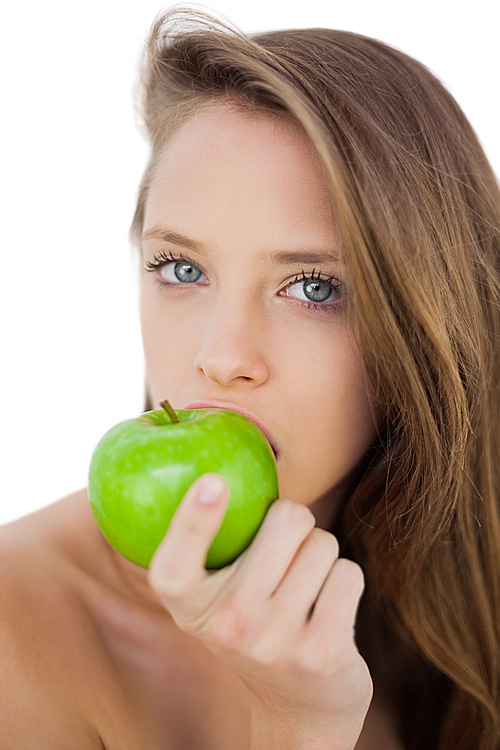 Serious brunette model eating an apple | 유토이미지 | 상세페이지 | 베이직샵 | 전체 ...
