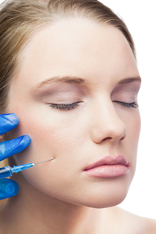 Calm cute model having botox injection on the cheek | 유토이미지 | 상세페이지 ...