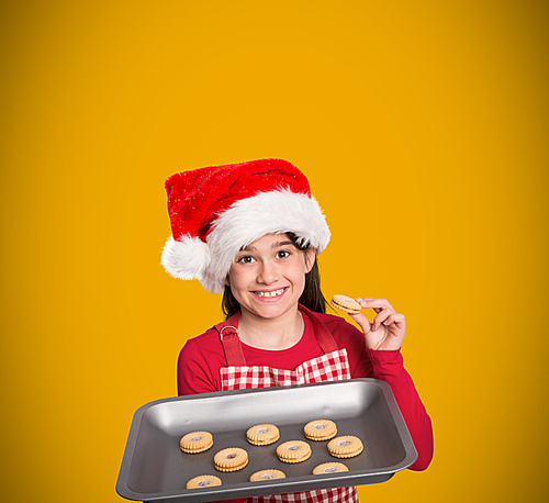 Composite image of festive little girl offering cookies | 유토이미지 | 상세페이지 ...