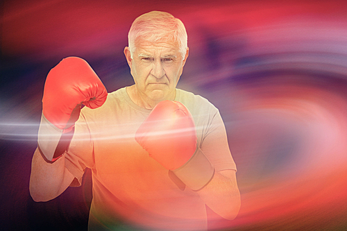 유토이미지 | Composite image of portrait of a determined senior boxer