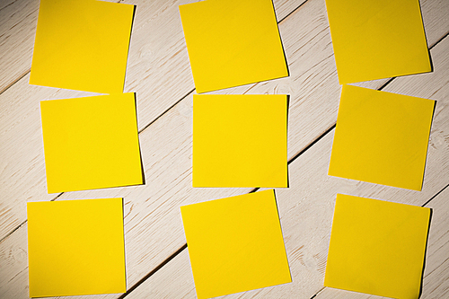 유토이미지 | Yellow post its on wooden backround
