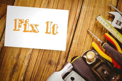 The word fix it and white card against desk with tools | 유토이미지 | 상세페이지 ...