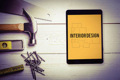 The word interior design and tablet pc against blueprint | 유토이미지 | 상세 ...