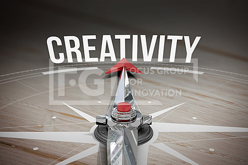 유토이미지 | The word creativity and compass against brown wooden background