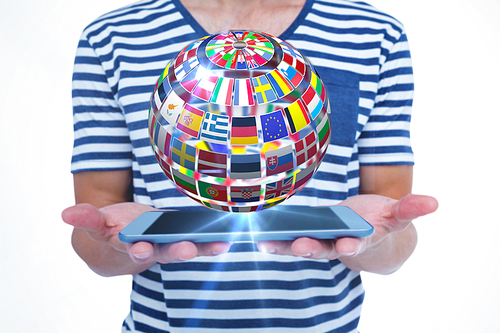 유토이미지 | Close up of man holding tablet against sphere made of flags