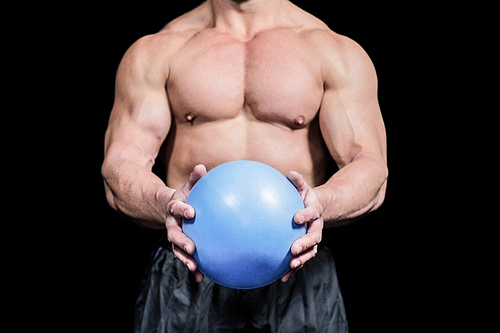 유토이미지 | Midsection of bodybuilder exercising with ball