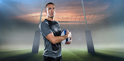 Composite image of confident rugby player in holding ball | 유토이미지 | 상세 ...