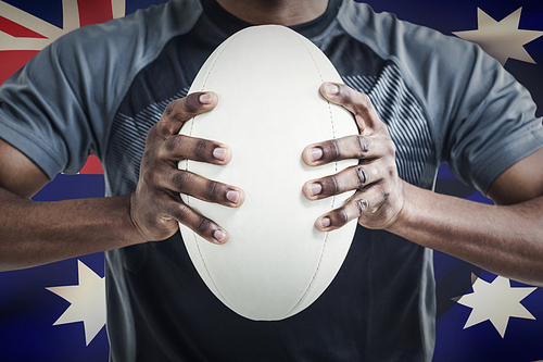 유토이미지 | Composite image of cropped image of sportsman pressing rugby ball