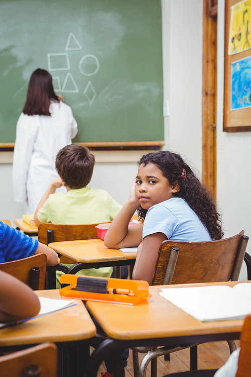 Bored student looking away from board at the elementary school | 유토이미지 ...