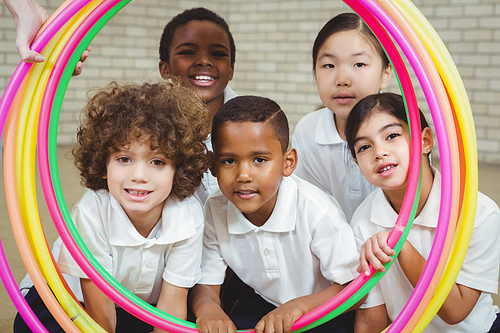 Students looking through hula hoops at the elementary school | 유토이미지 ...
