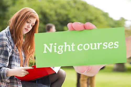 유토이미지 | The word night courses and hand showing card against pretty ...