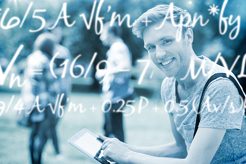 유토이미지 | Maths equation against handsome student studying outside on campus