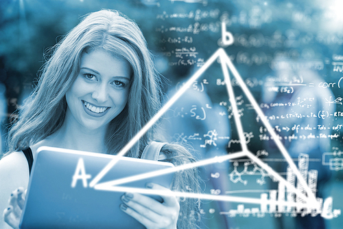 Maths equations against pretty student smiling at camera using tablet ...