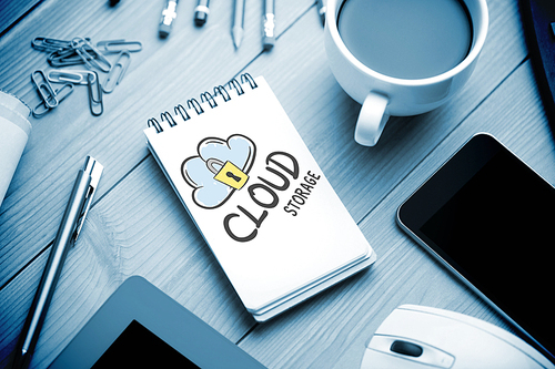 유토이미지 | Cloud storage against notepad on desk