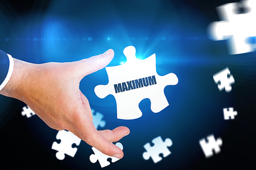 The word maximum and businessman pointing with his finger against blue ...