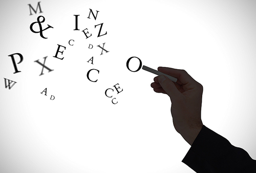 Hand holding a chalk and writing something against letters | 유토이미지 | 상세 ...