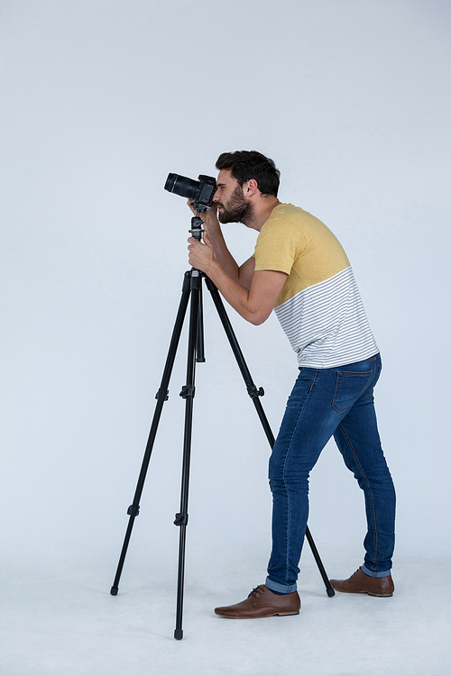 Photographer clicking picture using digital camera In the studio | 유토 ...