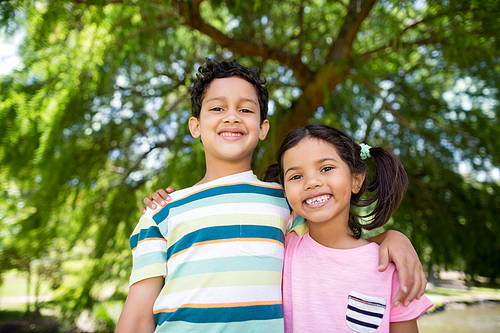 Portrait of two happy siblings standing together in park | 유토이미지 | 상세 ...