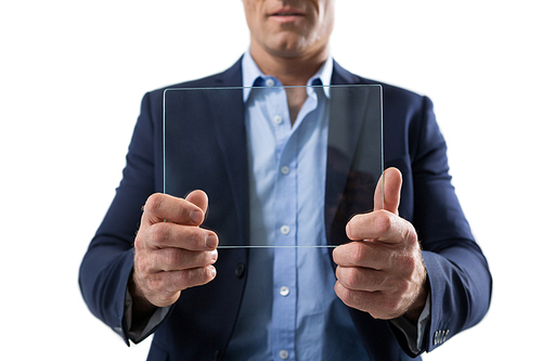 Mid section of businessman using a glass digital tablet against white ...