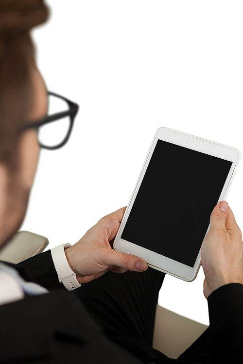 유토이미지 | Close up of businessman using tablet computer while sitting ...