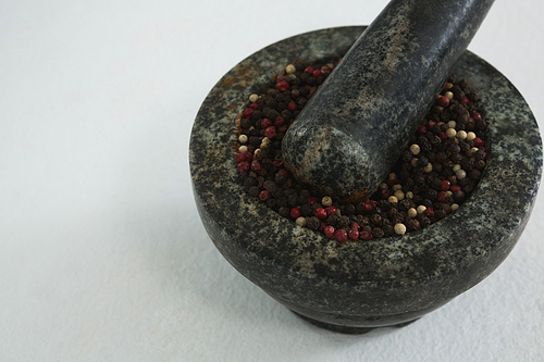 Black pepper in mortar and pestle on white background | 유토이미지 | 상세페이지 ...
