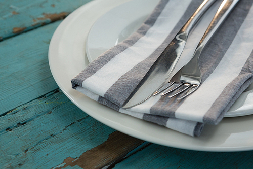 Close-up of table setting on weathered wooden plank | 유토이미지 | 상세페이지 ...