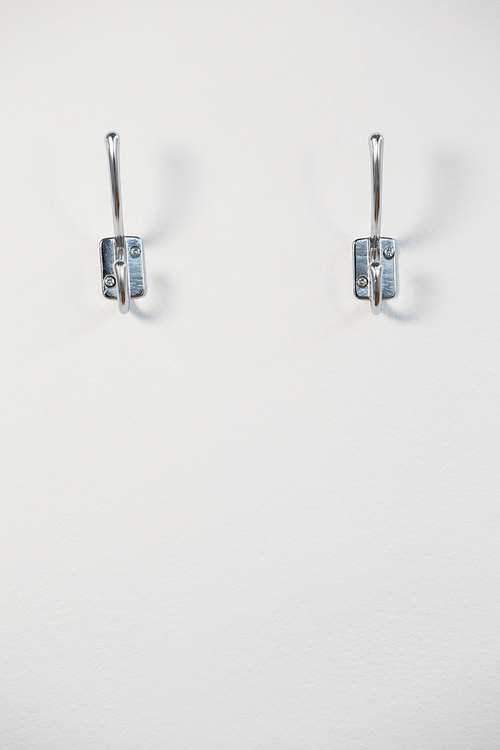 Empty hooks attached on wall | 유토이미지 | 상세페이지 | 베이직샵 | 사진 | 20494279