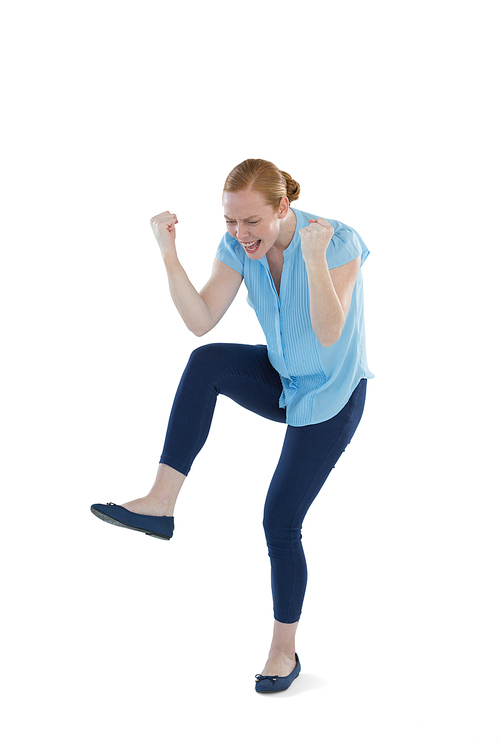 유토이미지 | Happy female executive dancing against white background