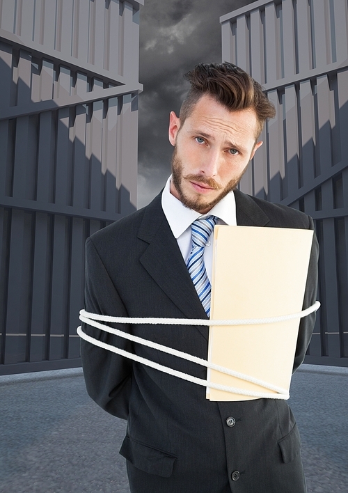 유토이미지 | Digital composite image of serious businessman tied up with ...