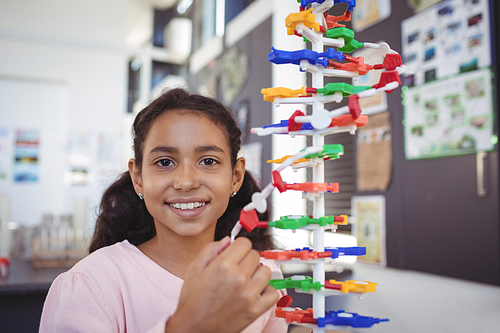 Portrait of smiling elementary student by model in classroom | 유토이미지 ...