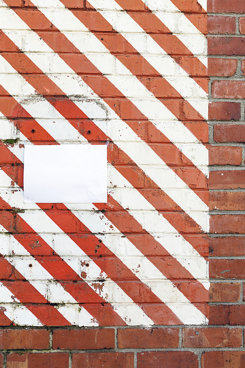 유토이미지 | Close up of a blank sign hanging on a wall with red and white ...