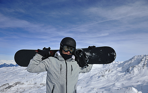 유토이미지 | happy young man have fan while relaxing at snow with ski and ...