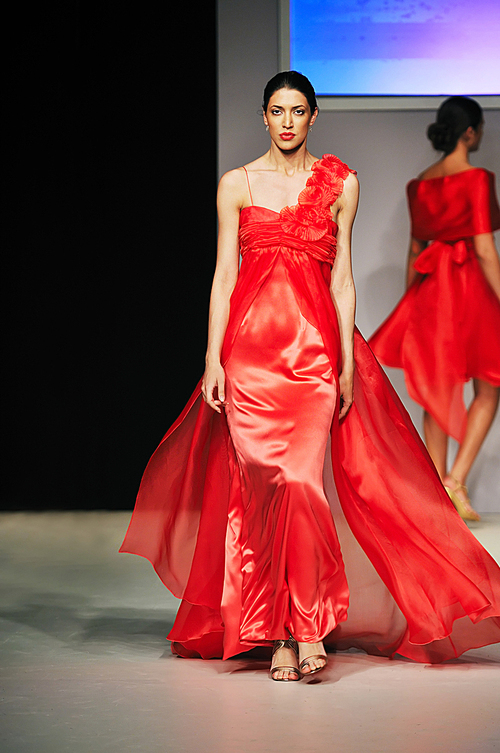 fashion show event and beautiful young woman at piste walking in luxury ...