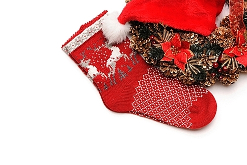 Traditional christmas wreath with santa hat an stocking isolated on ...