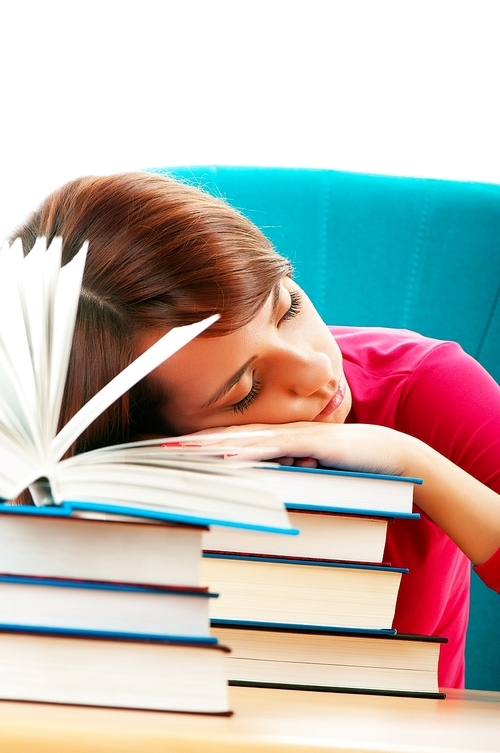 유토이미지 | Young female student with many study books