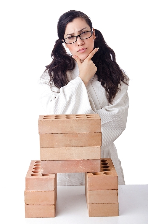 유토이미지 | Woman karate breaking bricks on white