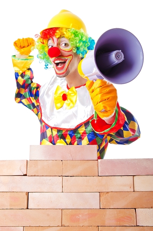 유토이미지 | Bad construction concept with clown laying bricks