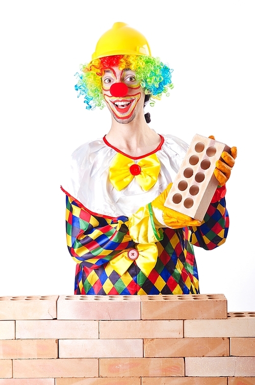 유토이미지 | Bad construction concept with clown laying bricks