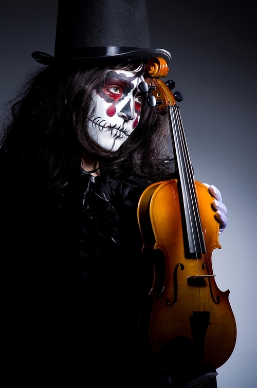 유토이미지 | Monster playing violin in dark room