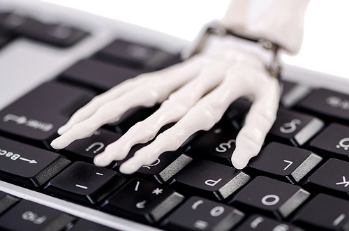 유토이미지 | Skeleton working on the keyboard