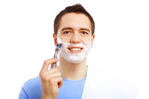 유토이미지 | Young man at home shaving himself in the morning