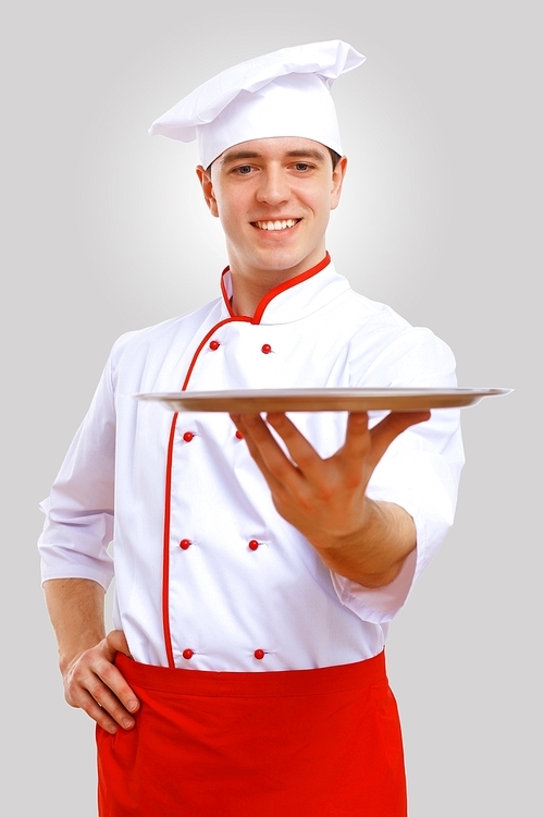 Young male chef in red apron against grey background | 유토이미지 | 상세페이지 ...