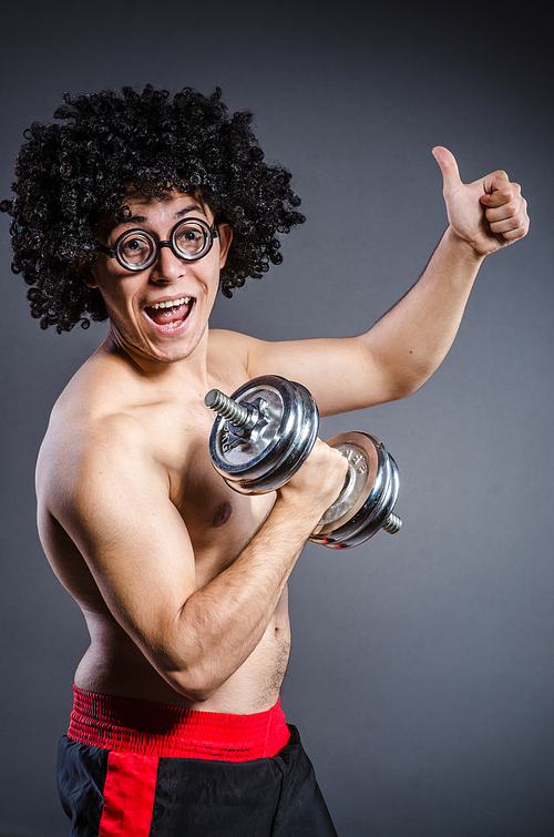유토이미지 | Funny man exercising with dumbbells